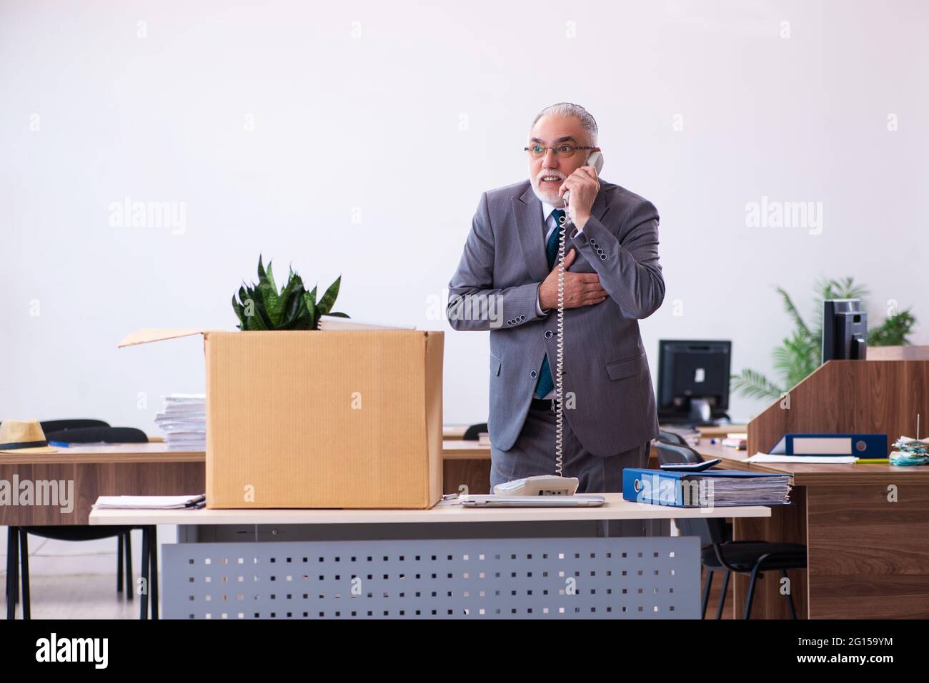 Old employee being fired from his work Stock Photo - Alamy