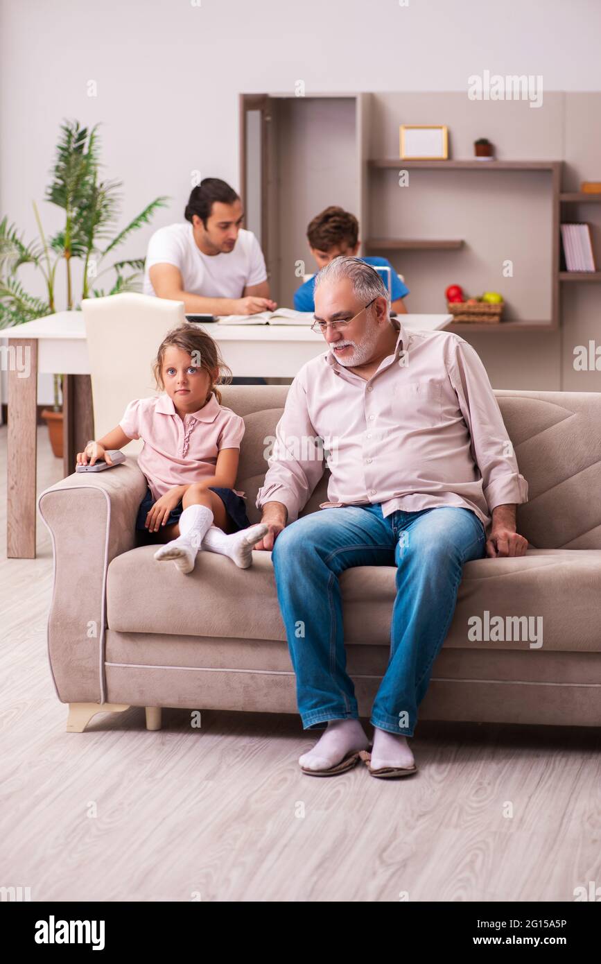 Three generations at home in early development concept Stock Photo - Alamy