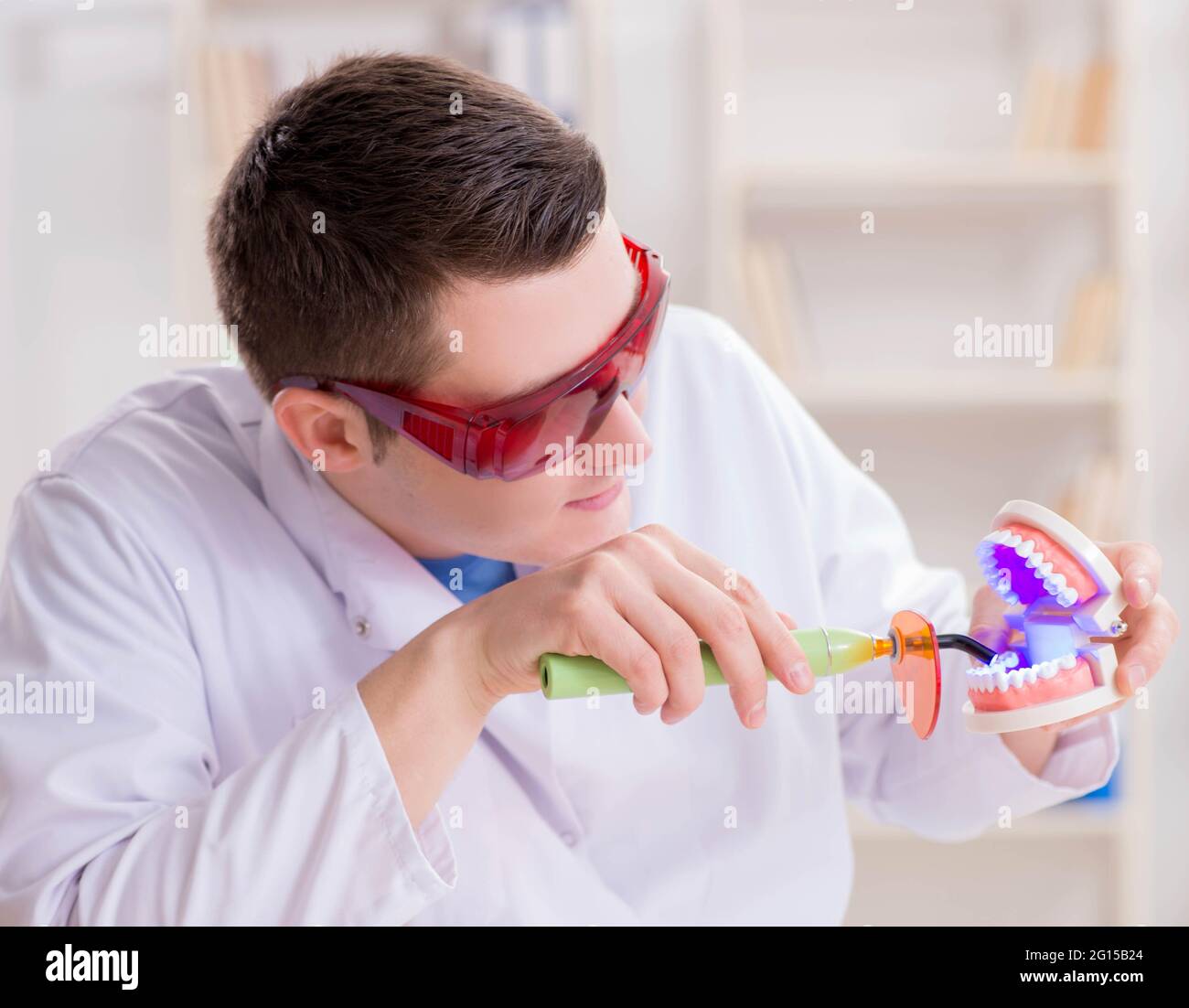 The dentist working teeth implant in medical lab Stock Photo - Alamy