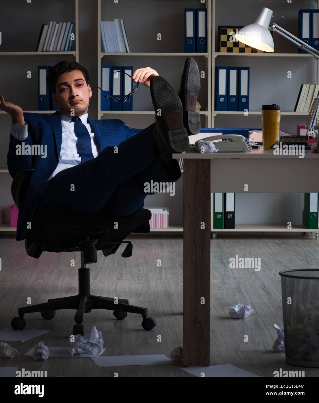 The employee working late to finish important deliverable task Stock ...