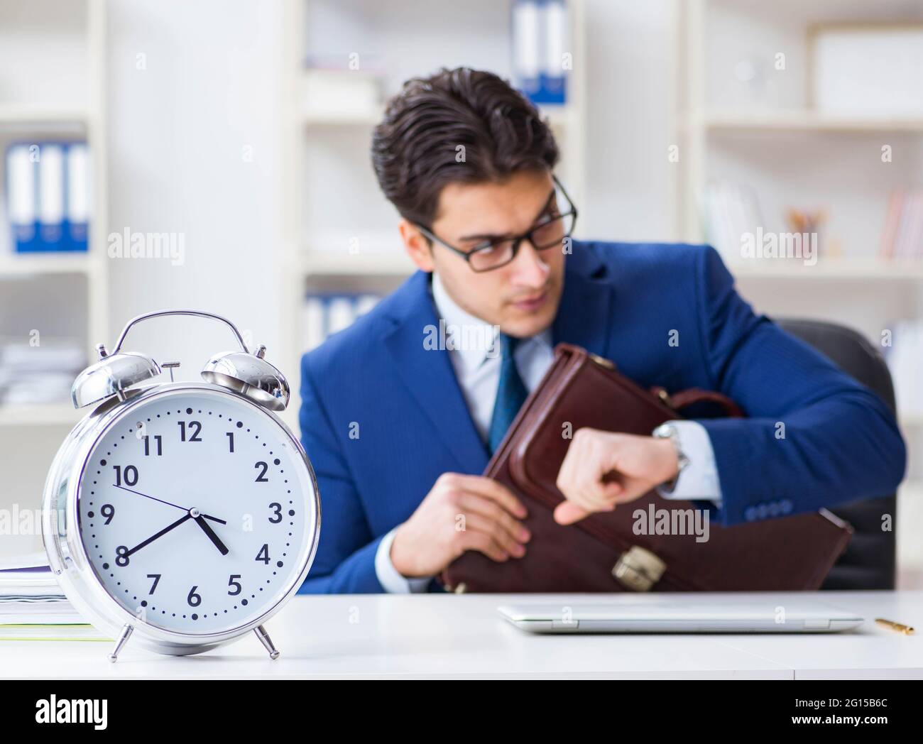 The businessman in bad time management concept Stock Photo - Alamy