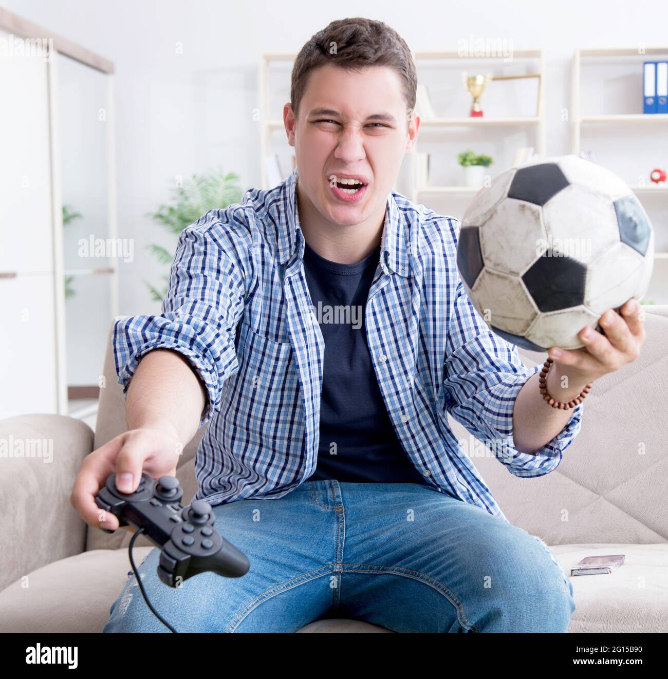 The young man playing computer games at home Stock Photo - Alamy