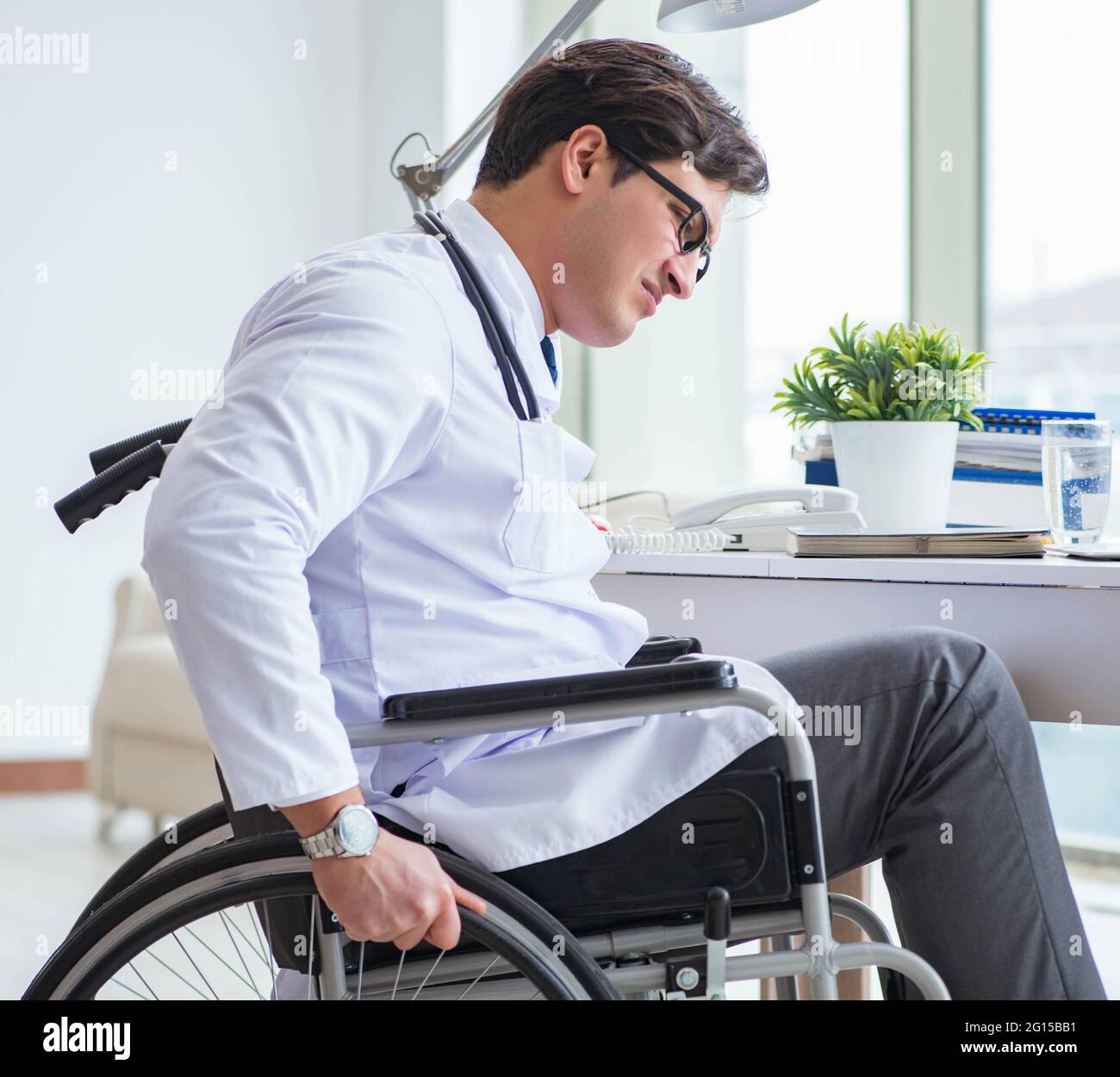 The disabled doctor on wheelchair working in hospital Stock Photo - Alamy