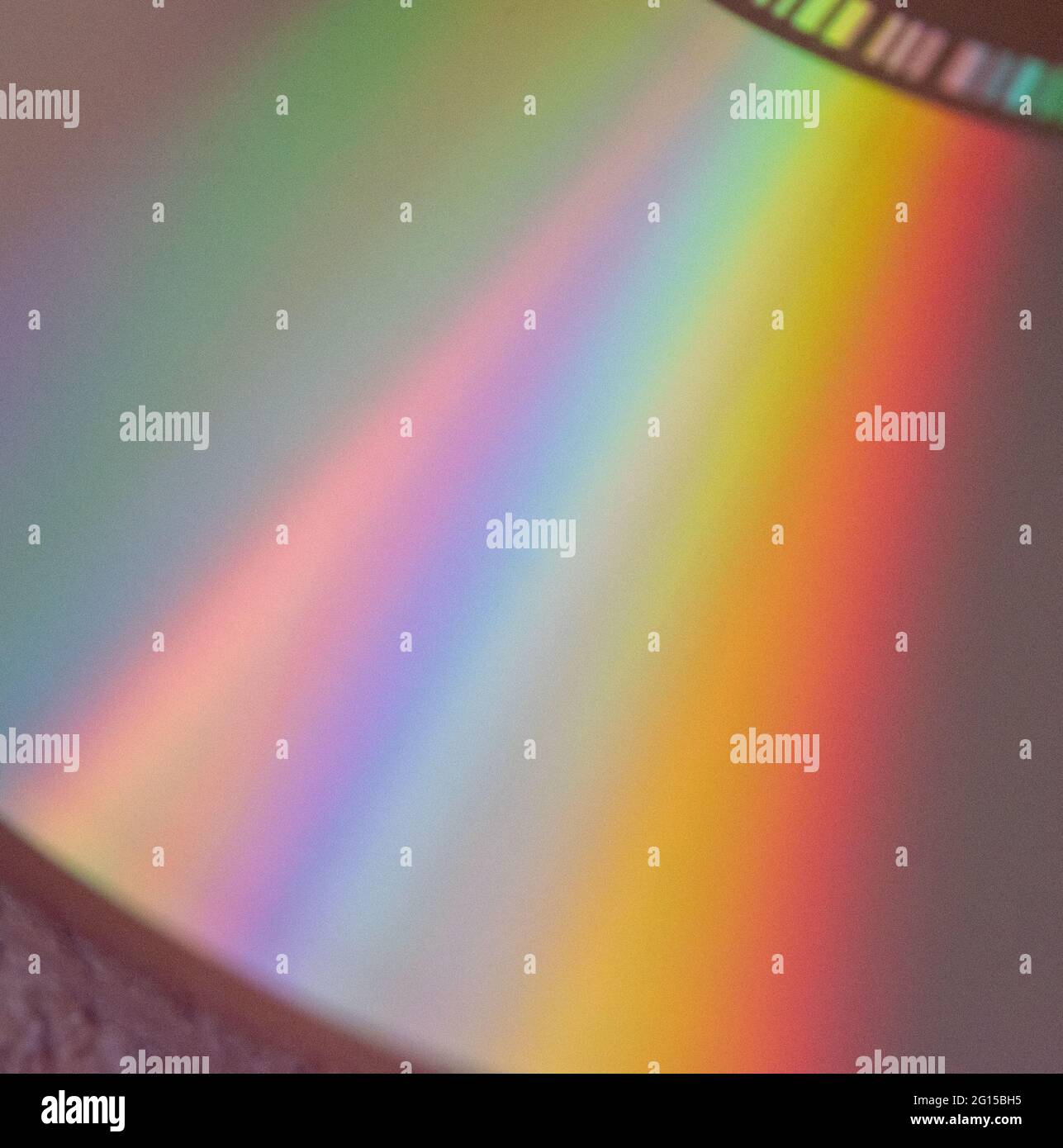 rainbow refracted light on cd rom / dvd Stock Photo - Alamy