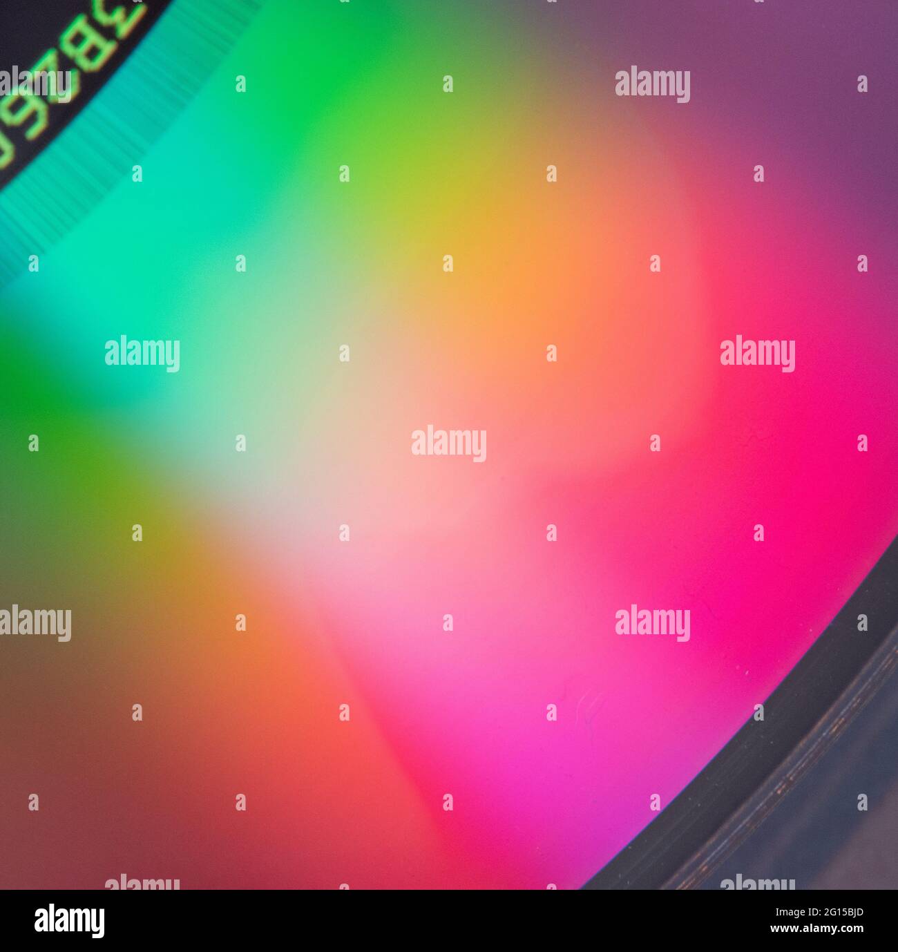 Abstract photo of the reflection of the bottom of a CD displaying a ...