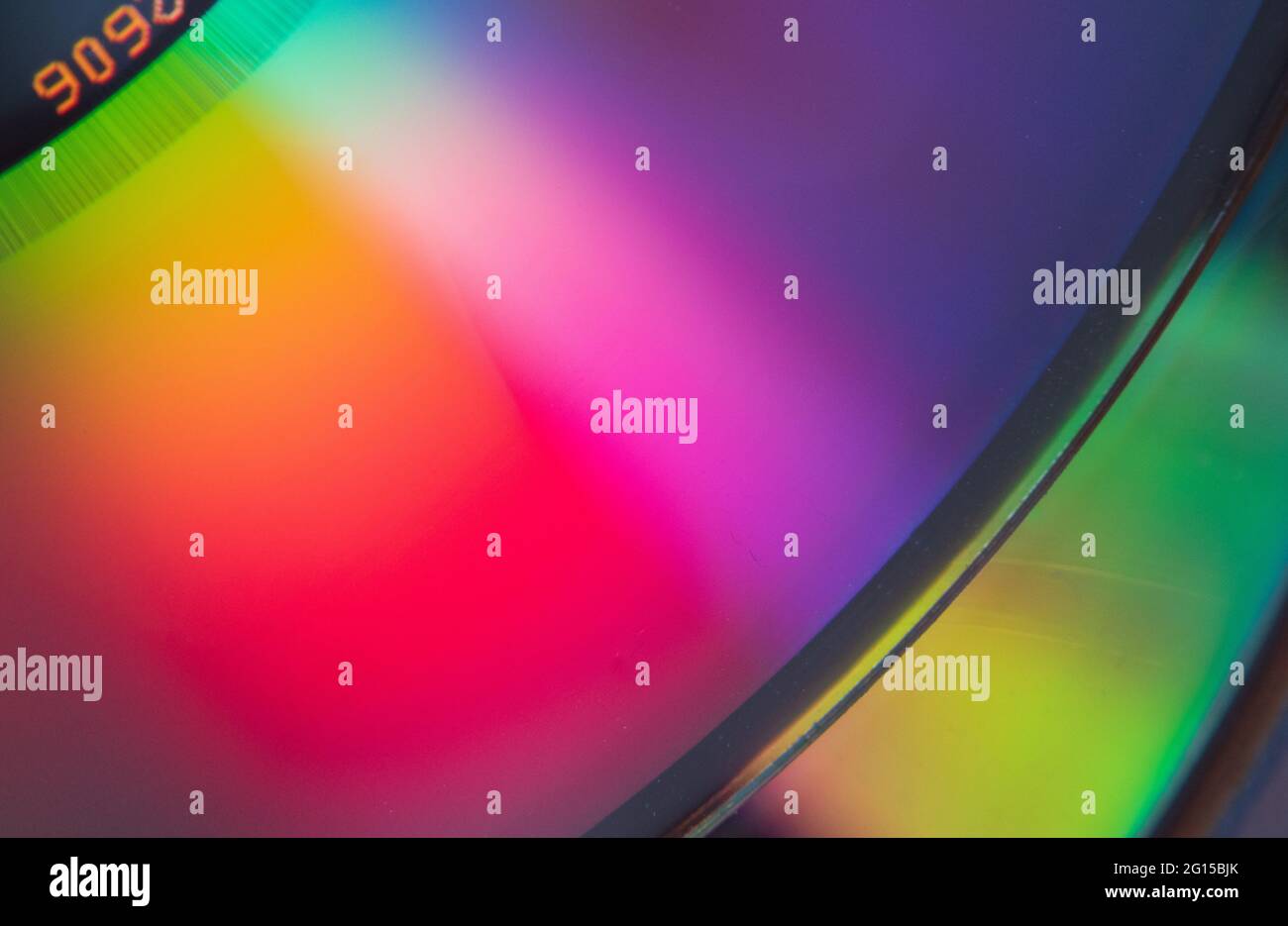 Abstract photo of the reflection of the bottom of a CD displaying a ...