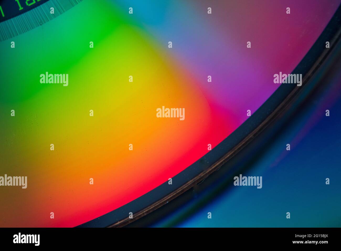 Abstract photo of the reflection of the bottom of a CD displaying a ...