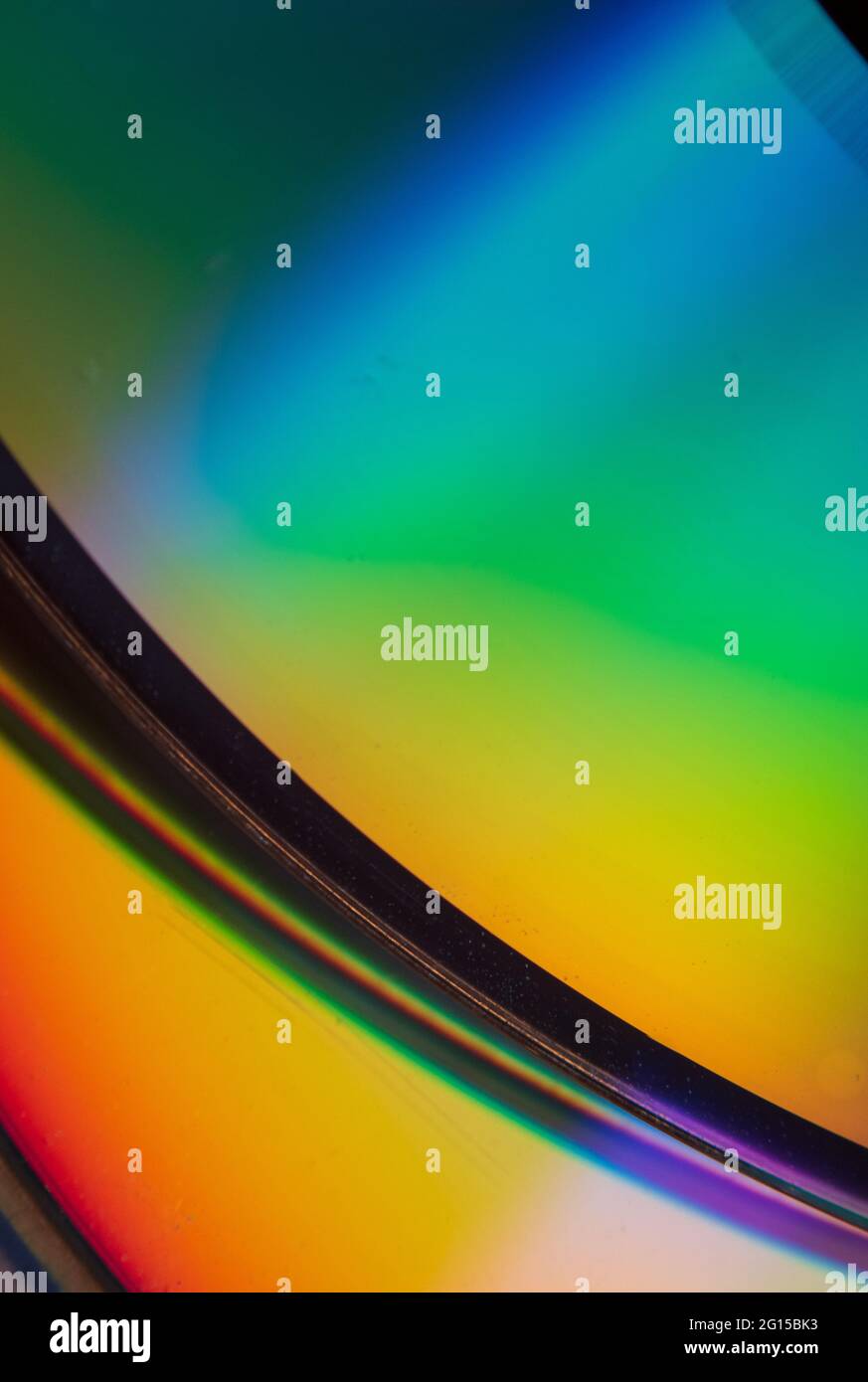 Abstract photo of the reflection of the bottom of a CD displaying a ...
