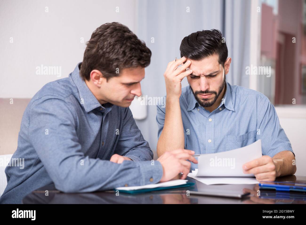 Two serious men documents hi-res stock photography and images - Alamy