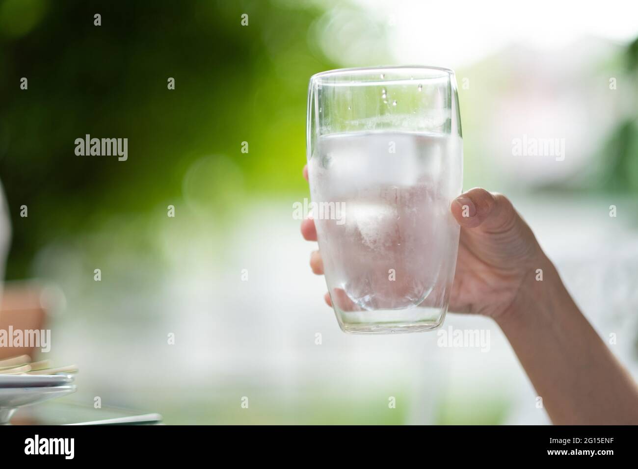closeup hand drinking fresh water, healthcare concept Stock Photo - Alamy