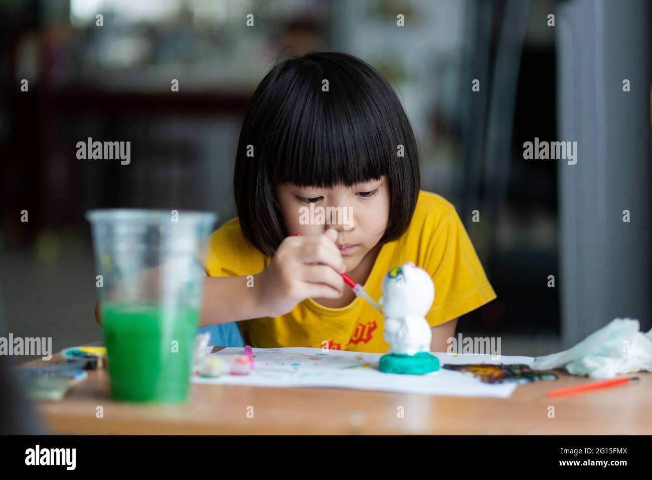 asian kid paint color on paper, education concept Stock Photo - Alamy