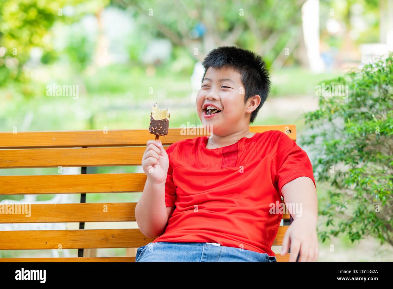 asian boy eating ice cream, summer season Stock Photo - Alamy