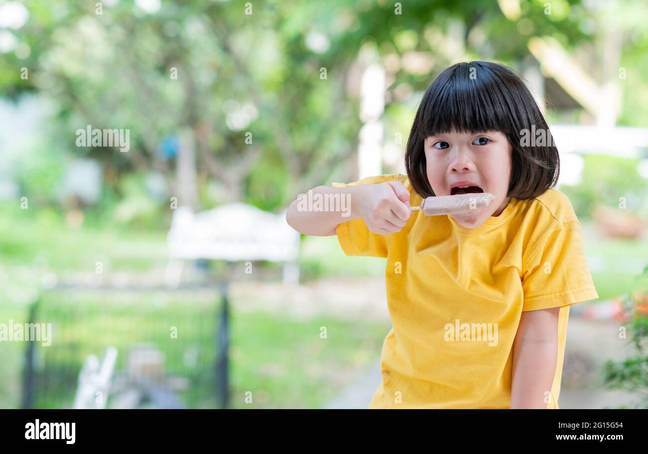 kid eating ice cream, delicious and happy concept Stock Photo - Alamy