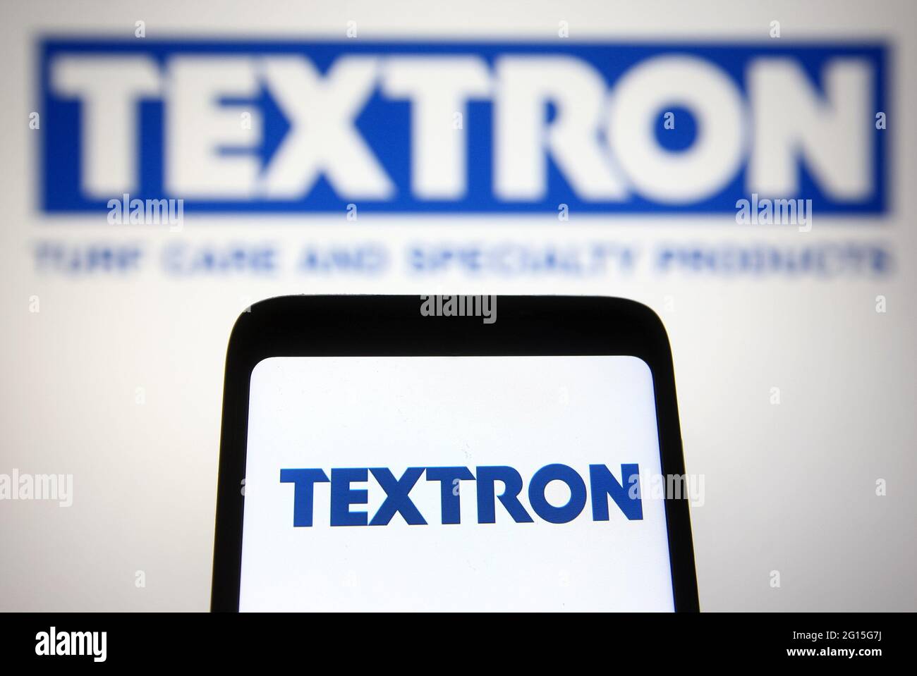 In this photo illustration, Textron logo of a US industrial conglomerate is seen on a smartphone ...