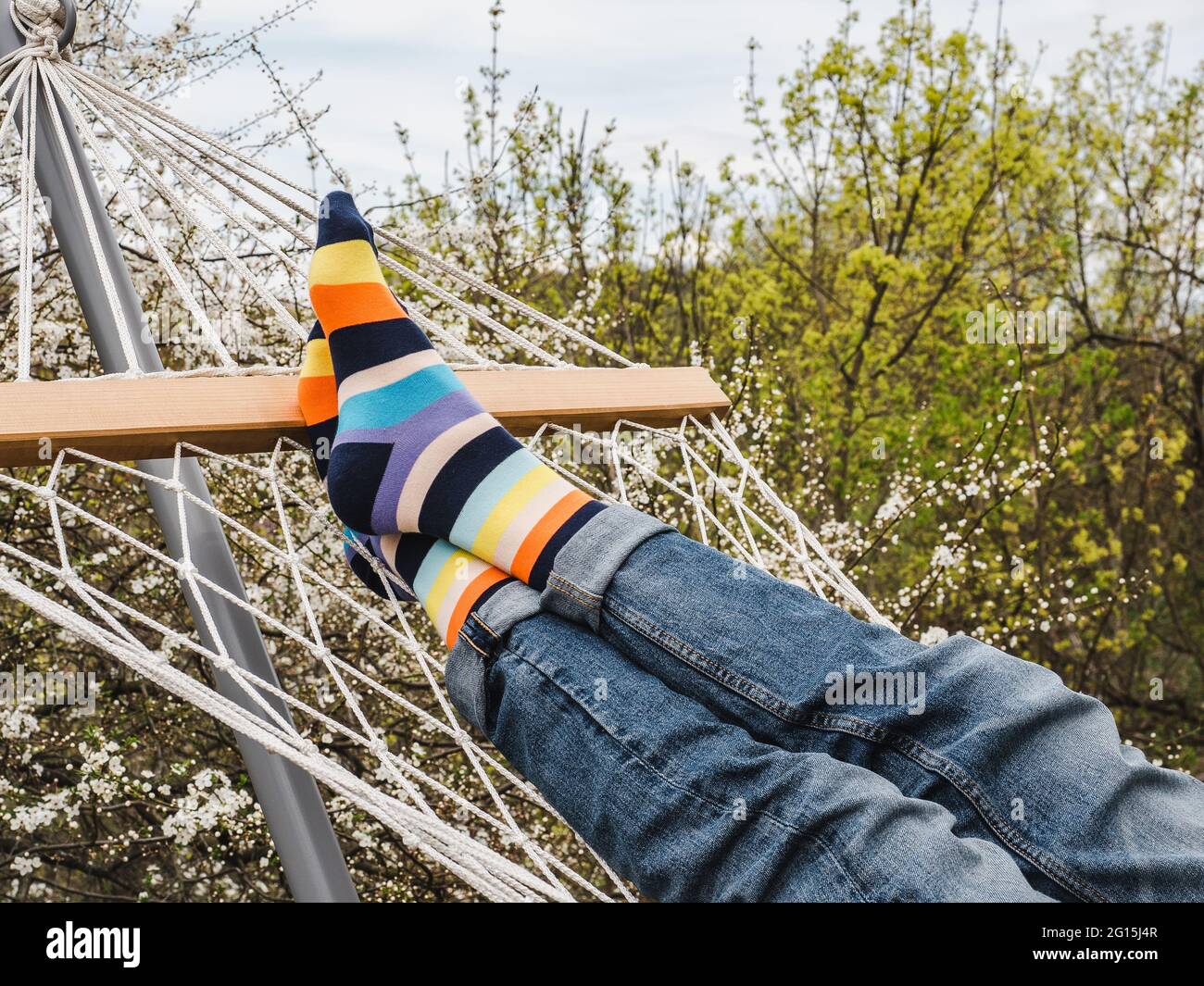 Men's legs and bright socks. Close-up, outdoor. Style, beauty and ...