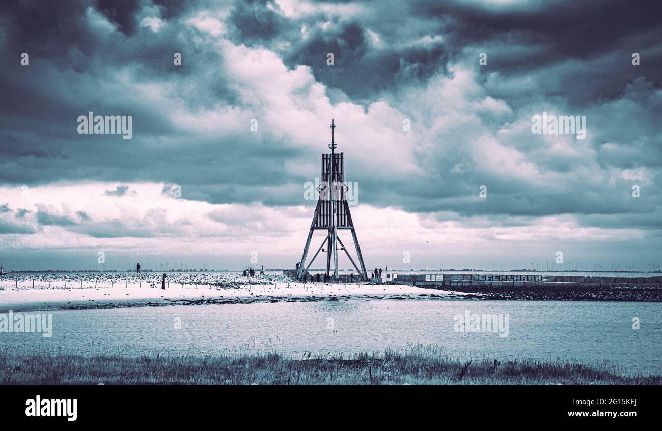 Cuxhaven on the German North Sea coast. The Kugelbake, a wooden beacon ...