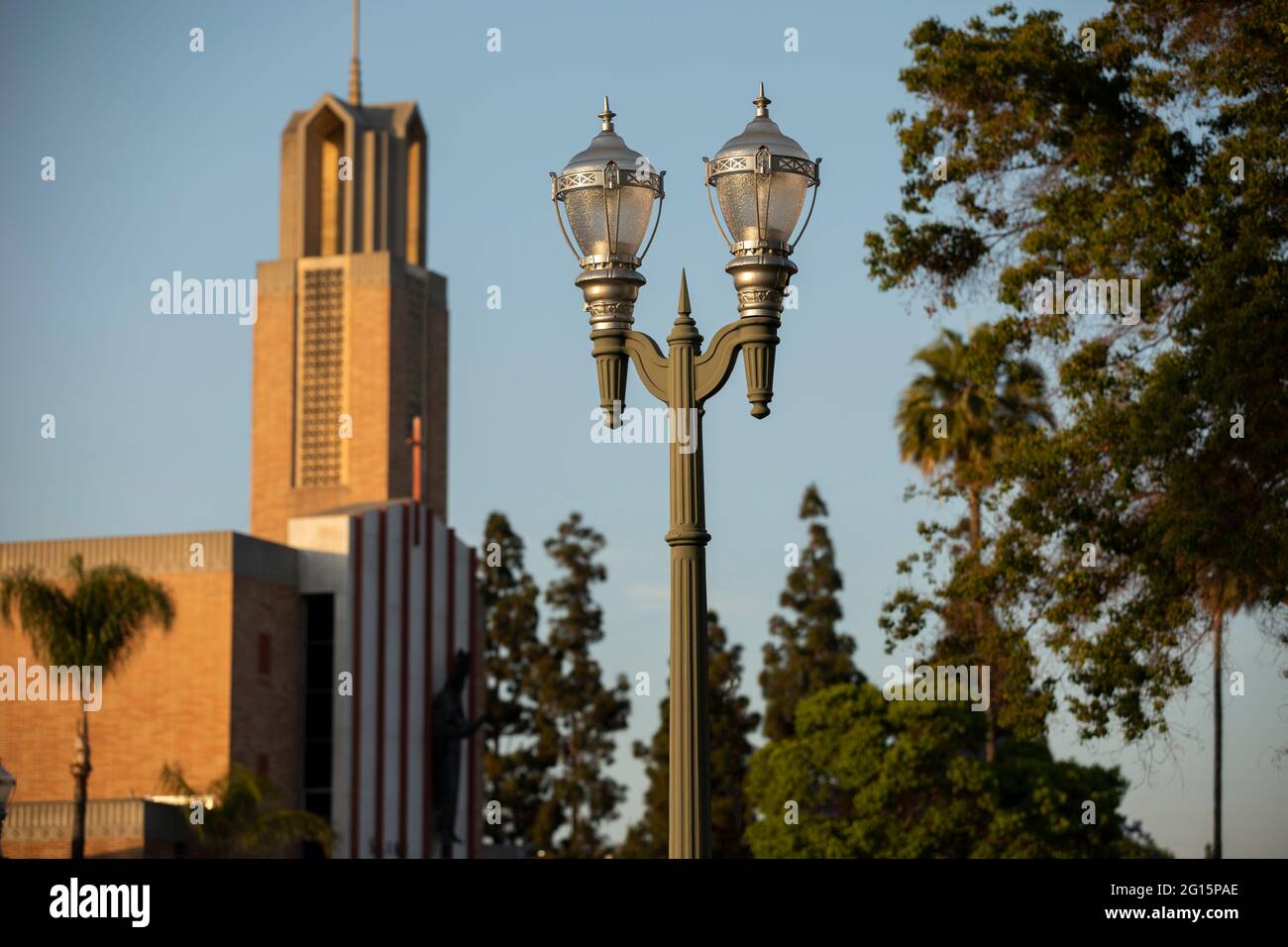 Sunset palm framed view of the historic downtown Anaheim, California ...