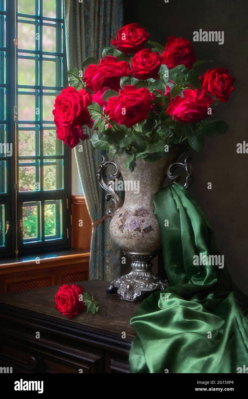 Still life with bouquet of red roses Stock Photo - Alamy