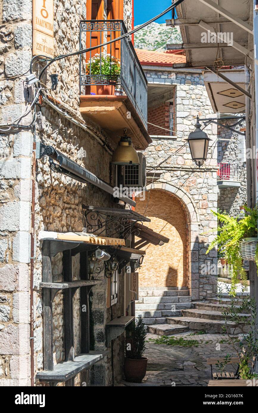 Cobbled alley and stone houses in the mountain town of Arachova at the ...
