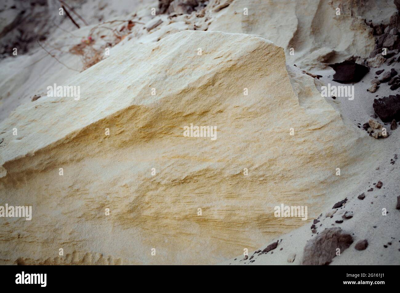 The natural background is the texture of sand. Sandy hill with traces ...