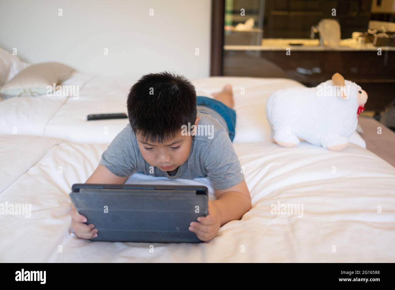 asian chinese boy playing smartphone, kid use phone and play game ...
