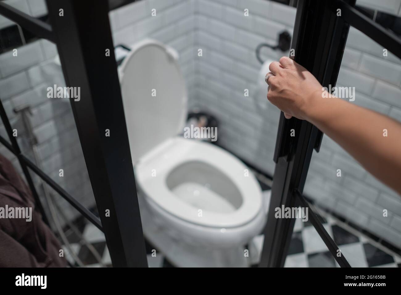 open the bathroom door, go to toilet Stock Photo - Alamy