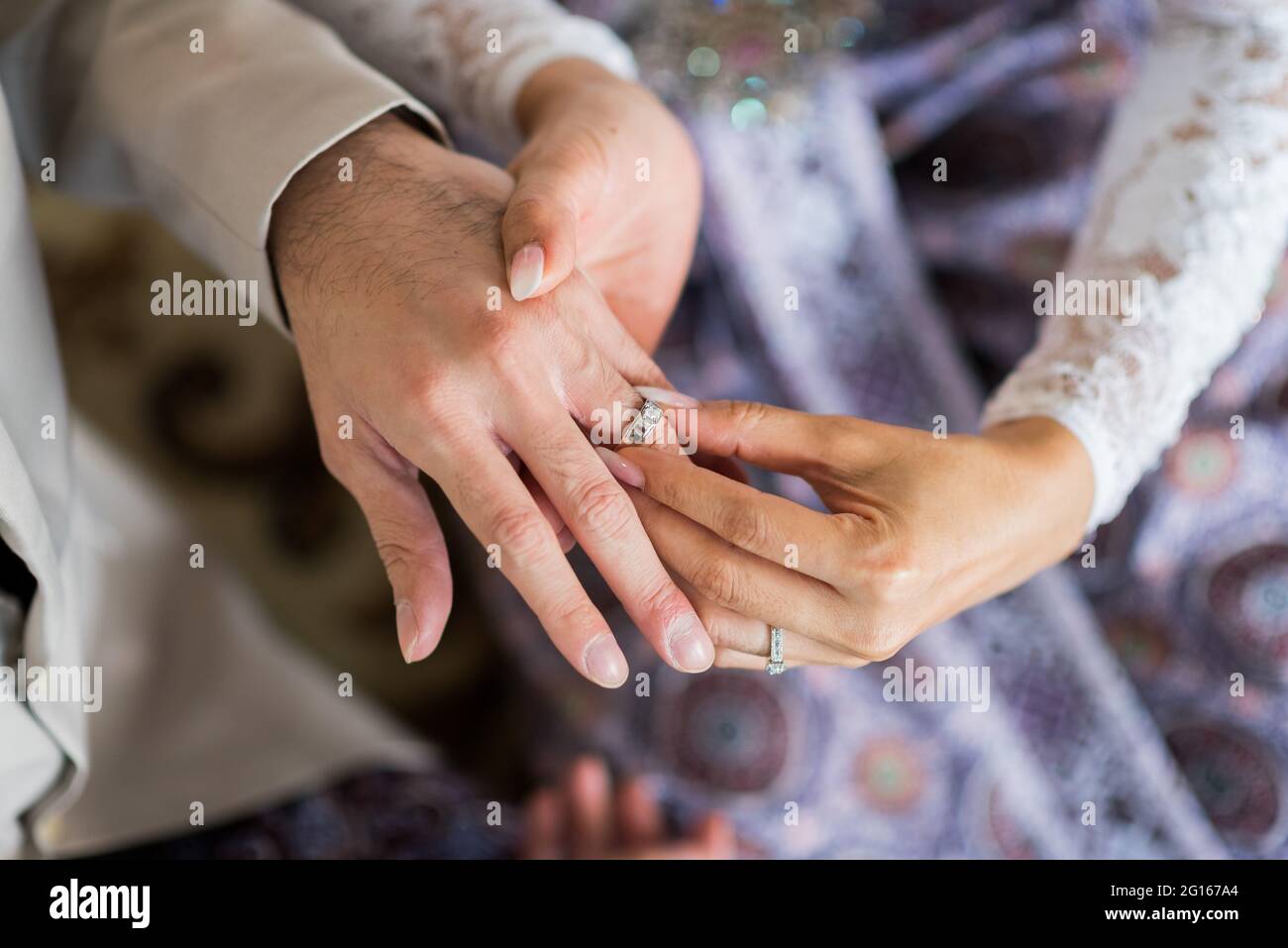 wear a ring, wedding ring, love couple Stock Photo - Alamy
