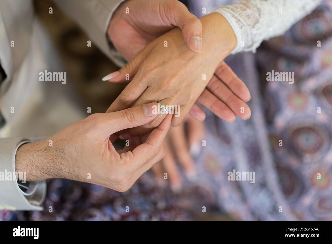 wear a ring, wedding ring, love couple Stock Photo - Alamy