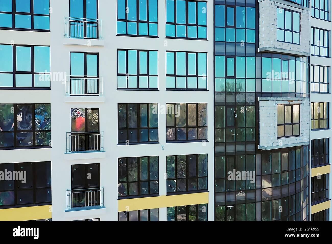 Many windows on new apartment building facade under construction. Real ...