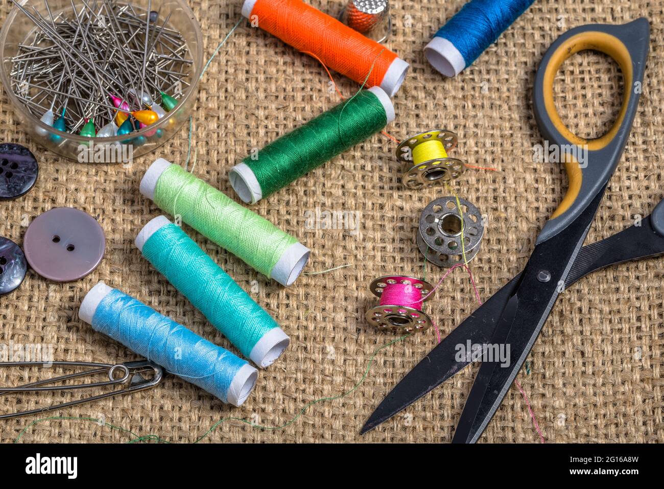 Sewing kit on a textile background Stock Photo - Alamy