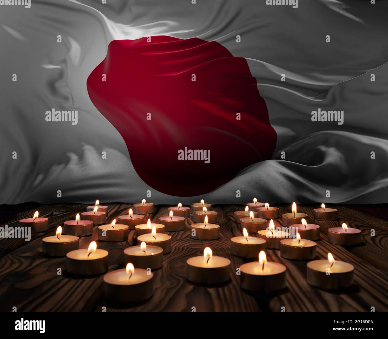 Mourning candles burning on Japan national flag of background. Memorial ...
