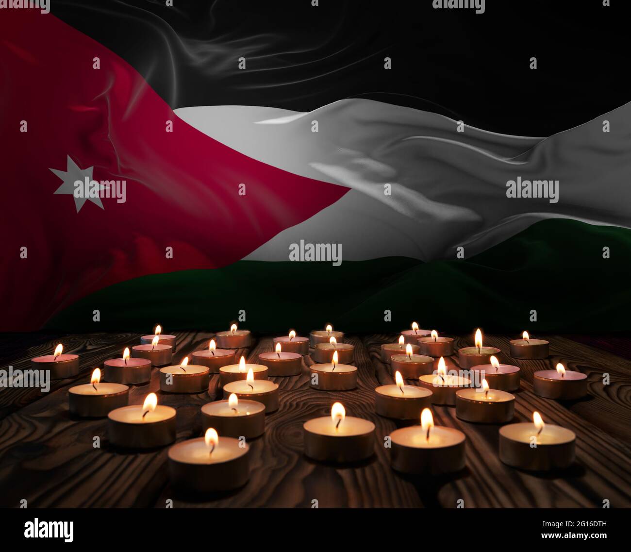 Mourning candles burning on Jordan national flag of background ...