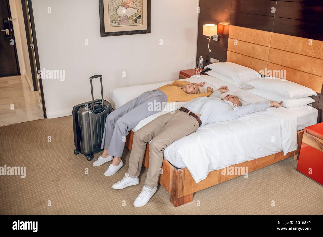 Married couple laying on bed hi-res stock photography and images - Alamy