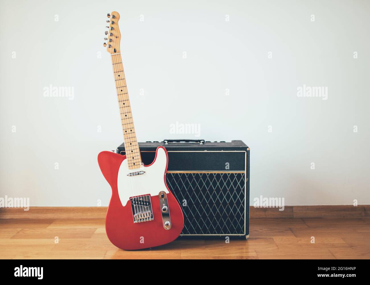 Red electric guitar and classic amplifier Stock Photo - Alamy