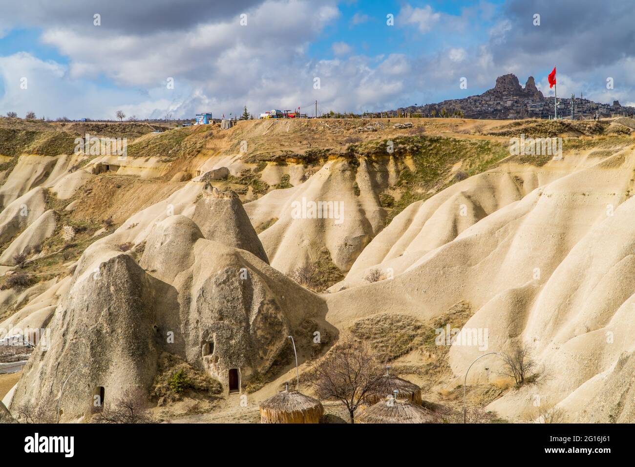 Houses inside fairy chimneys and unique rock formations with Turkish ...