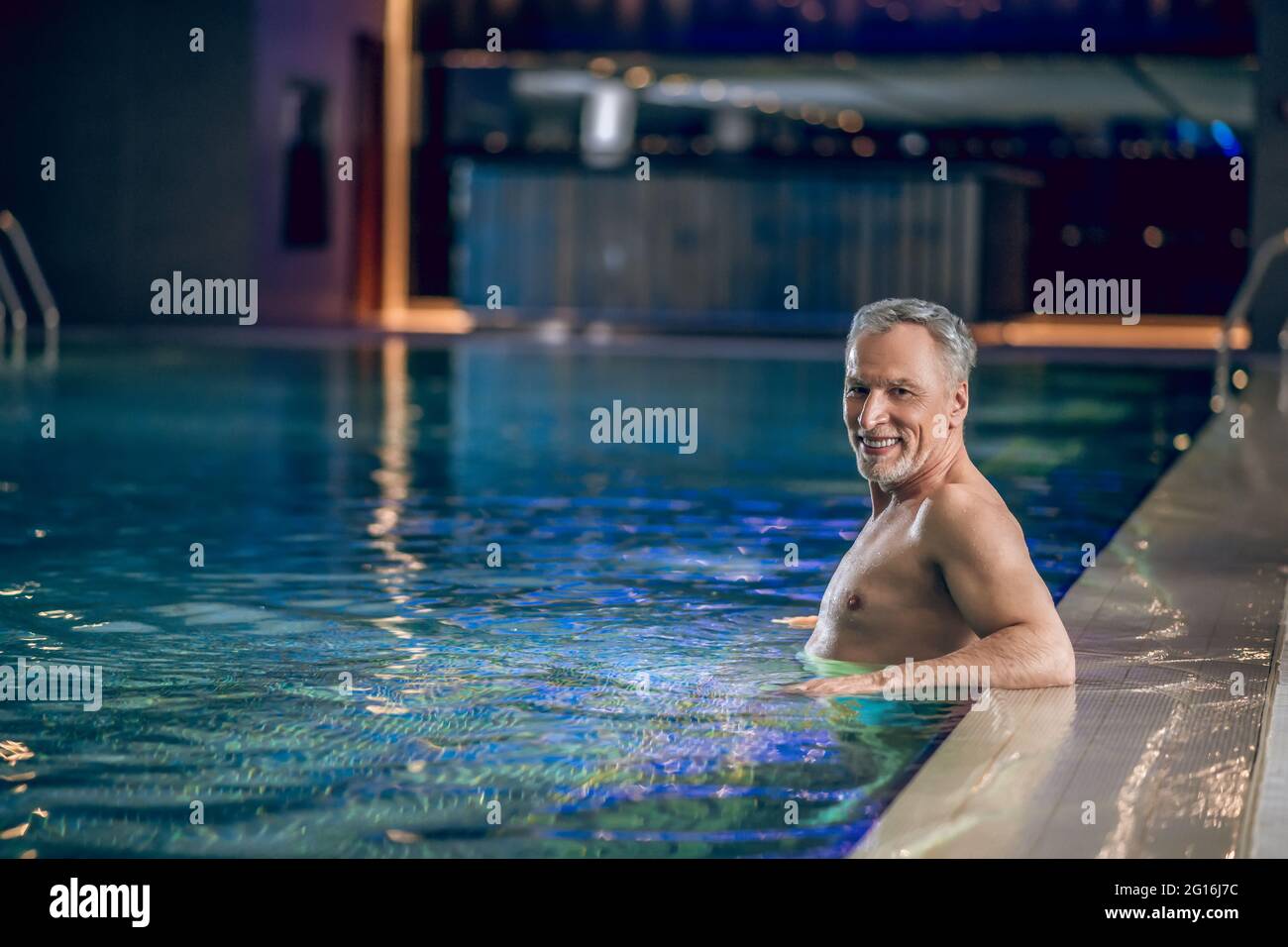 Good looking man in swimming pool hi-res stock photography and images ...