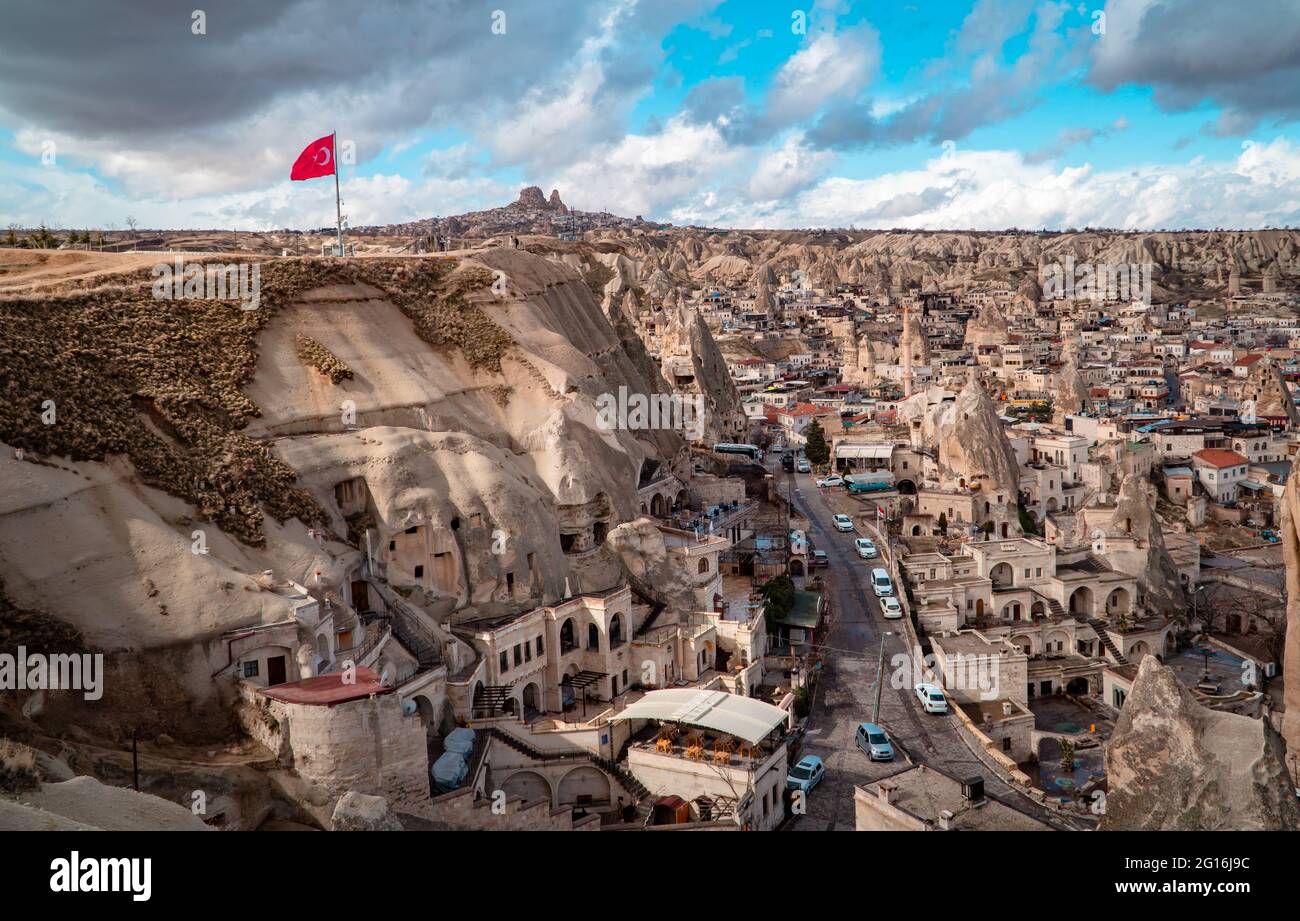 Houses inside fairy chimneys and unique rock formations with Turkish ...