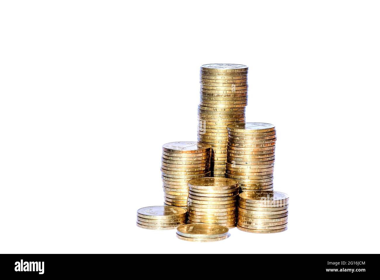 Many coins in column isolated on white background Stock Photo - Alamy