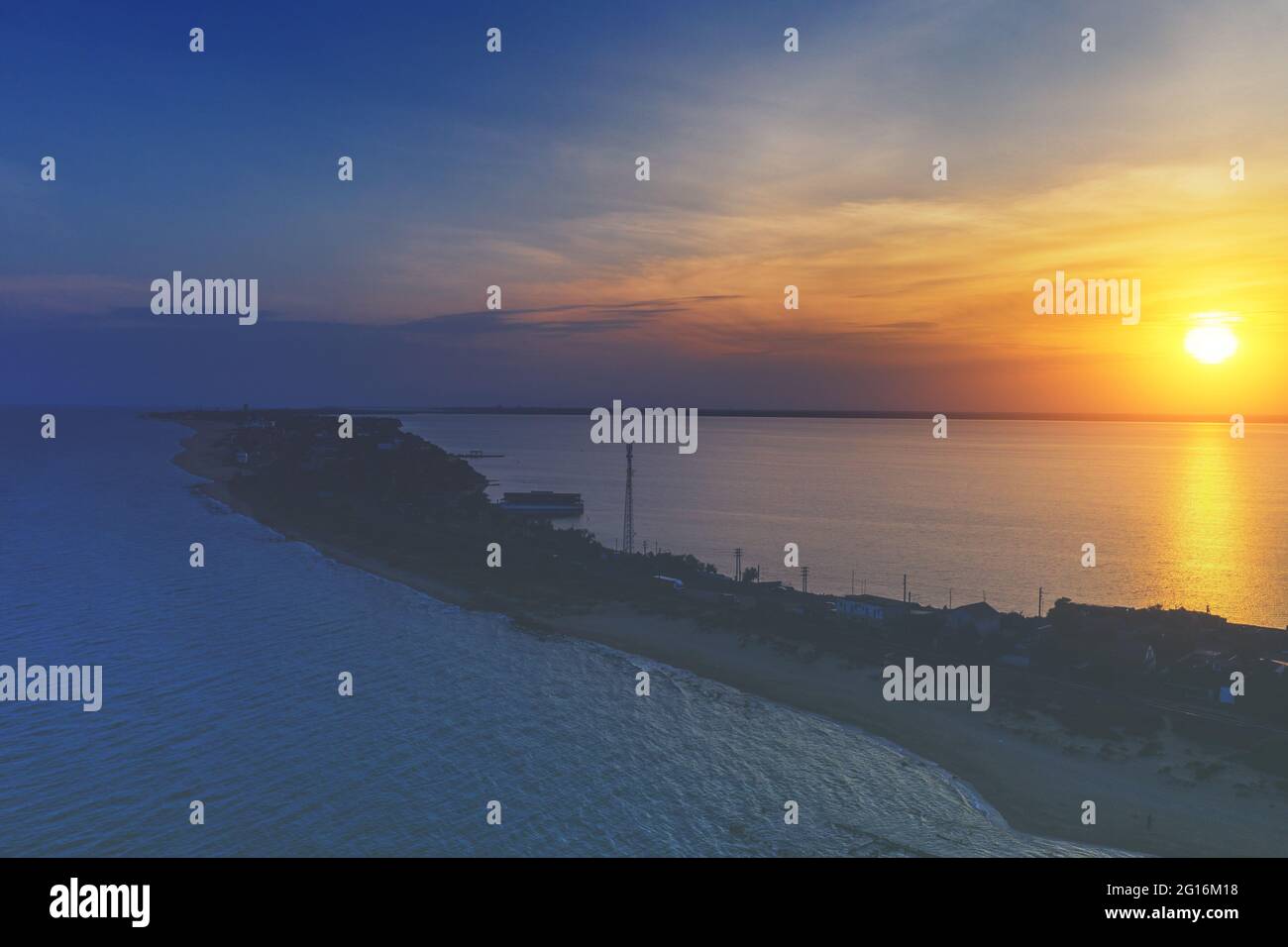 Aerial view of the spit in the sea during sunset. Top view of the sea ...