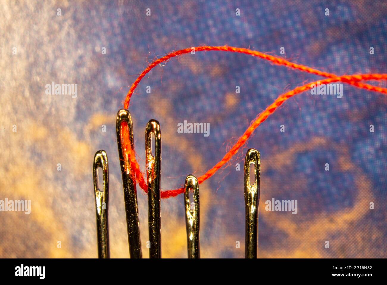 Golden thread needle hi-res stock photography and images - Alamy