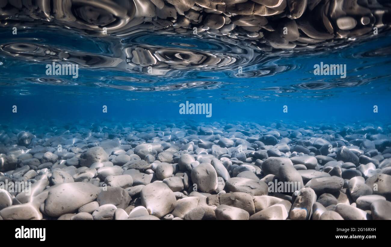 Underwater ocean with stones bottom, reflection and blue water Stock ...
