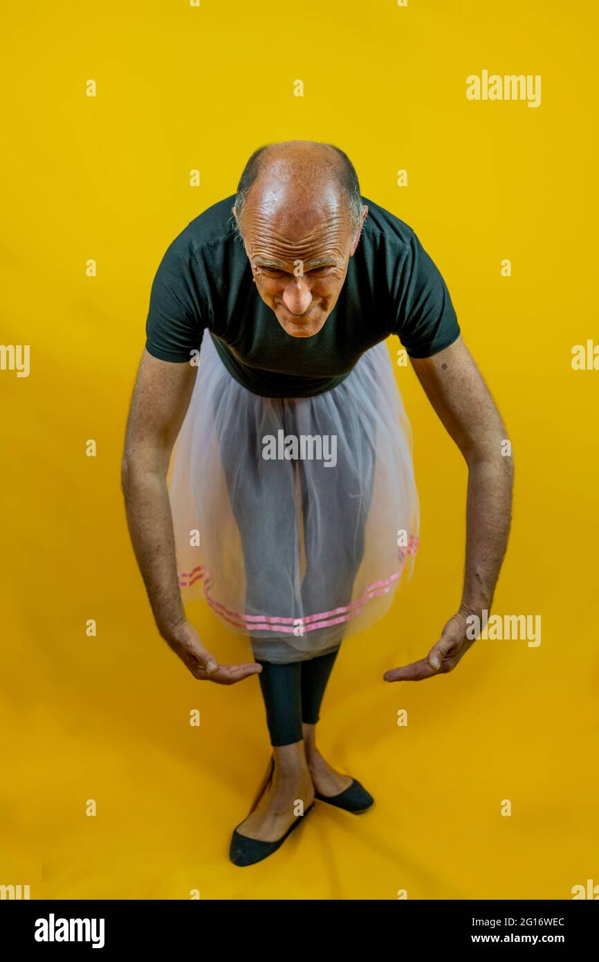 funny portrait of male ballet dancer. A mature ballet dancer dressed in ...
