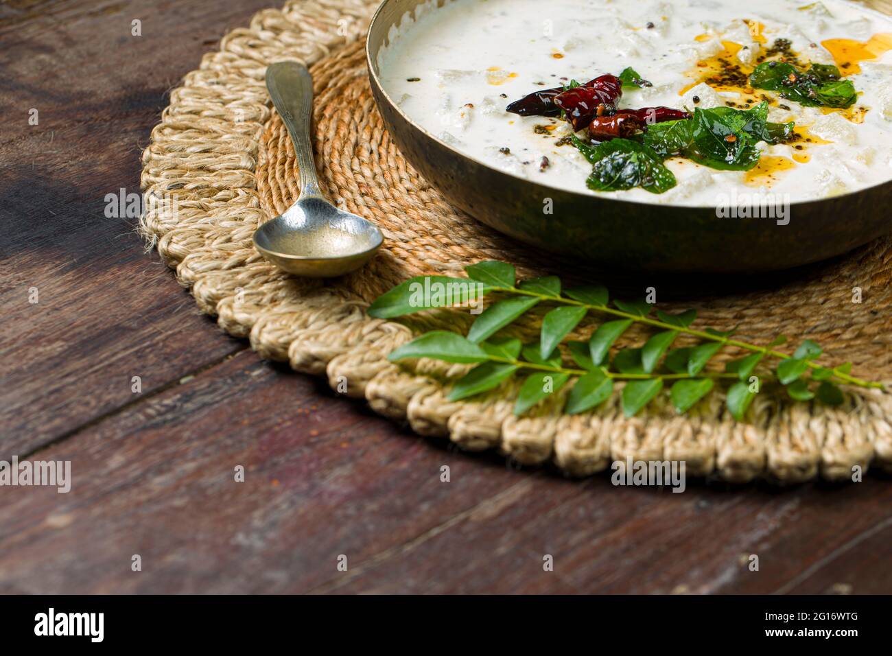 Pachadi or Raitha south Indian side dish made using ash guard, curd and ...