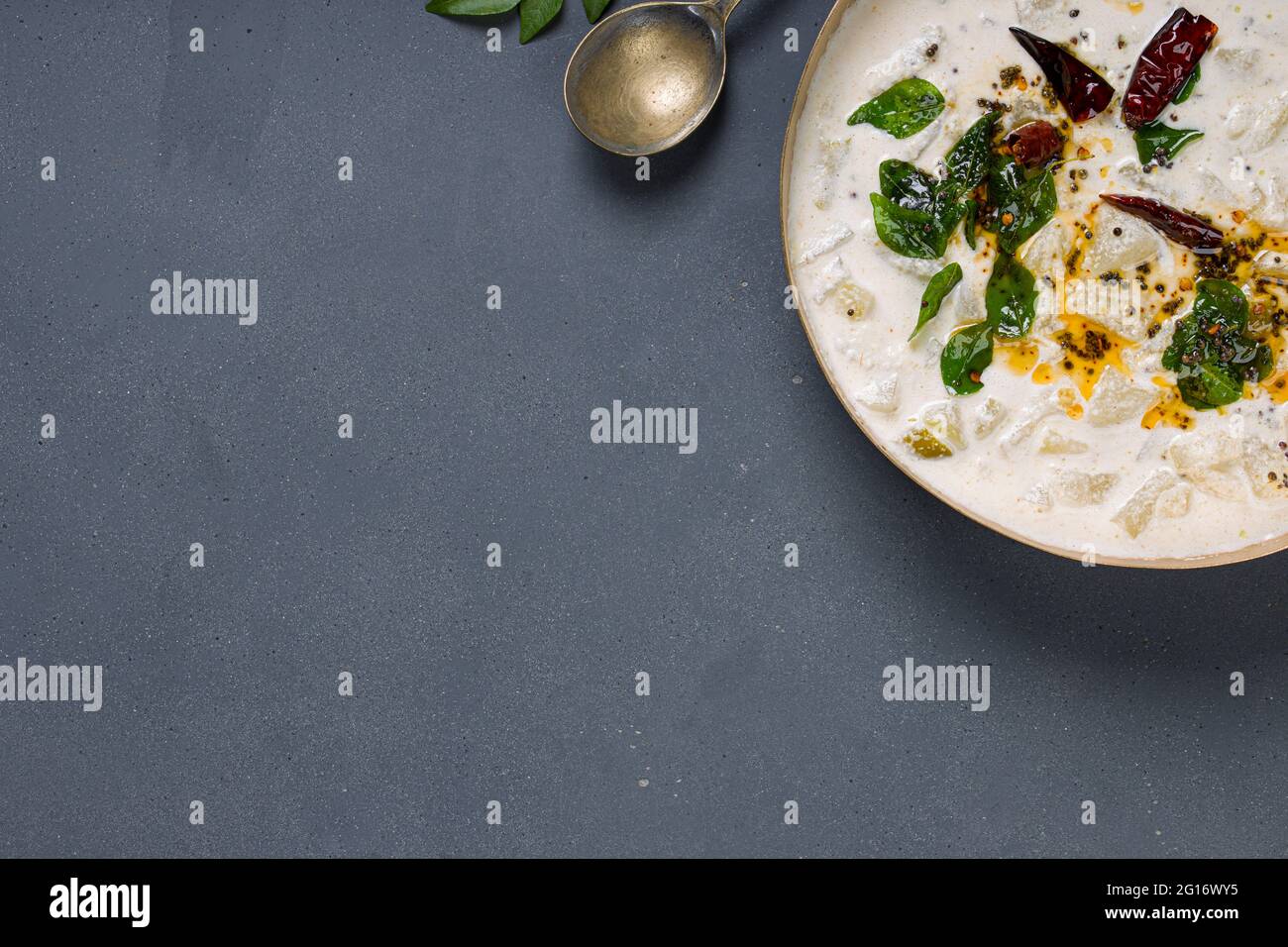 Pachadi or Raitha south Indian side dish made using ash guard, curd and ...