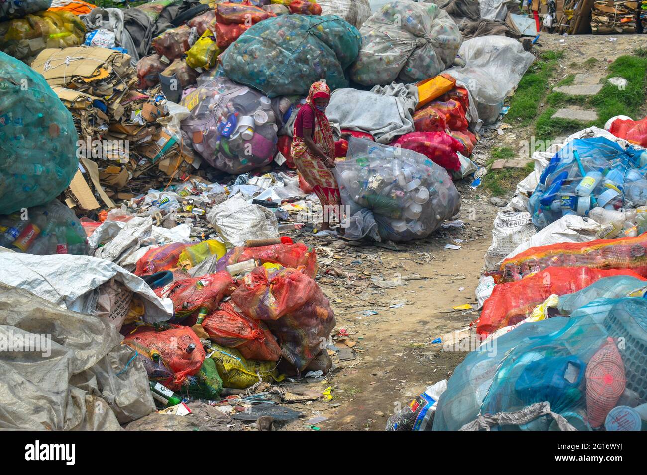 A woman working in a garbage yard on World Environment day in Kolkata ...