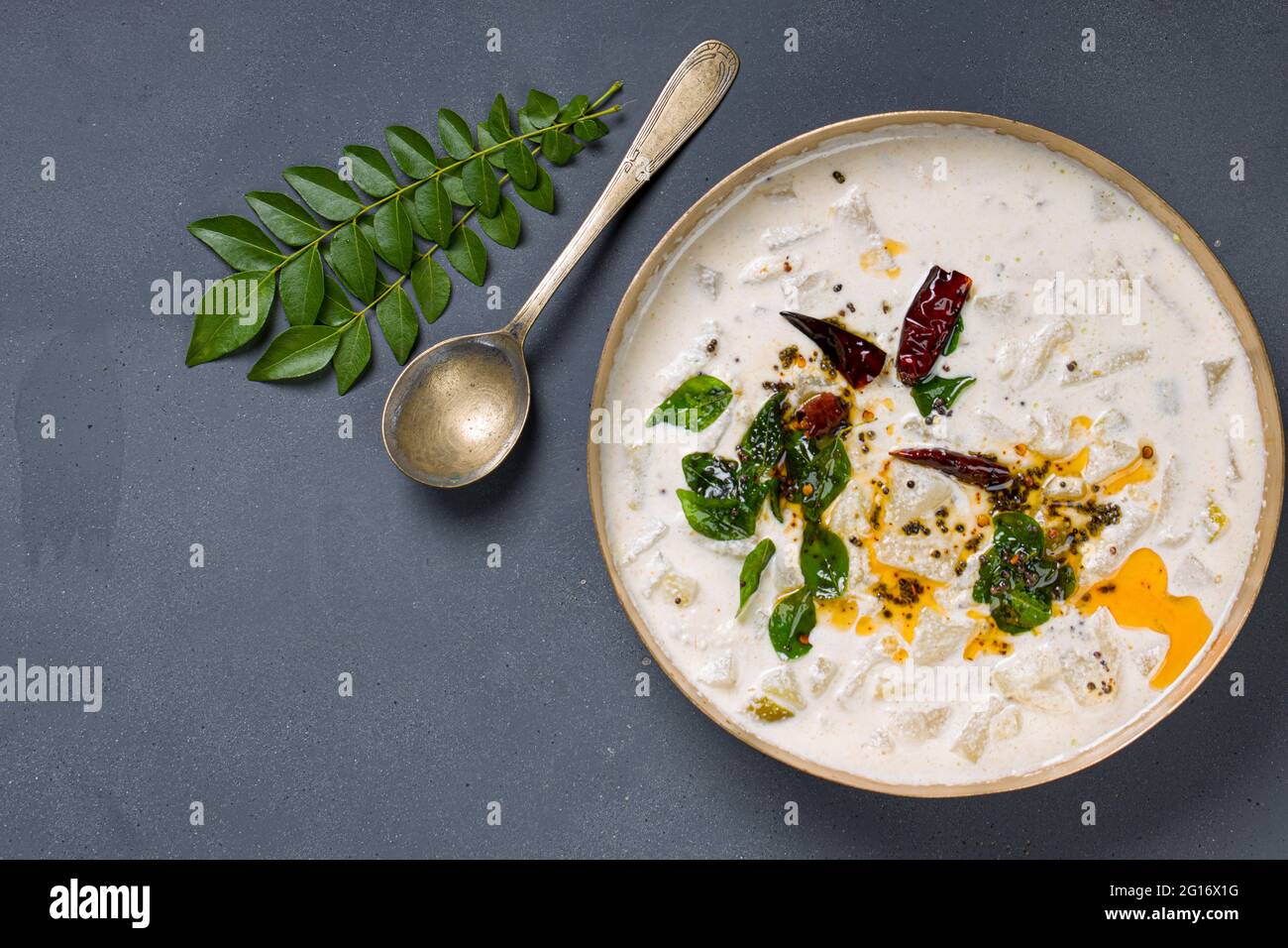 Pachadi or Raitha south Indian side dish made using ash guard, curd and ...