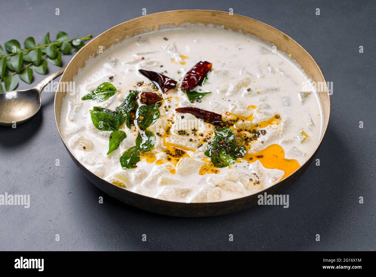 Pachadi or Raitha south Indian side dish made using ash guard, curd and ...