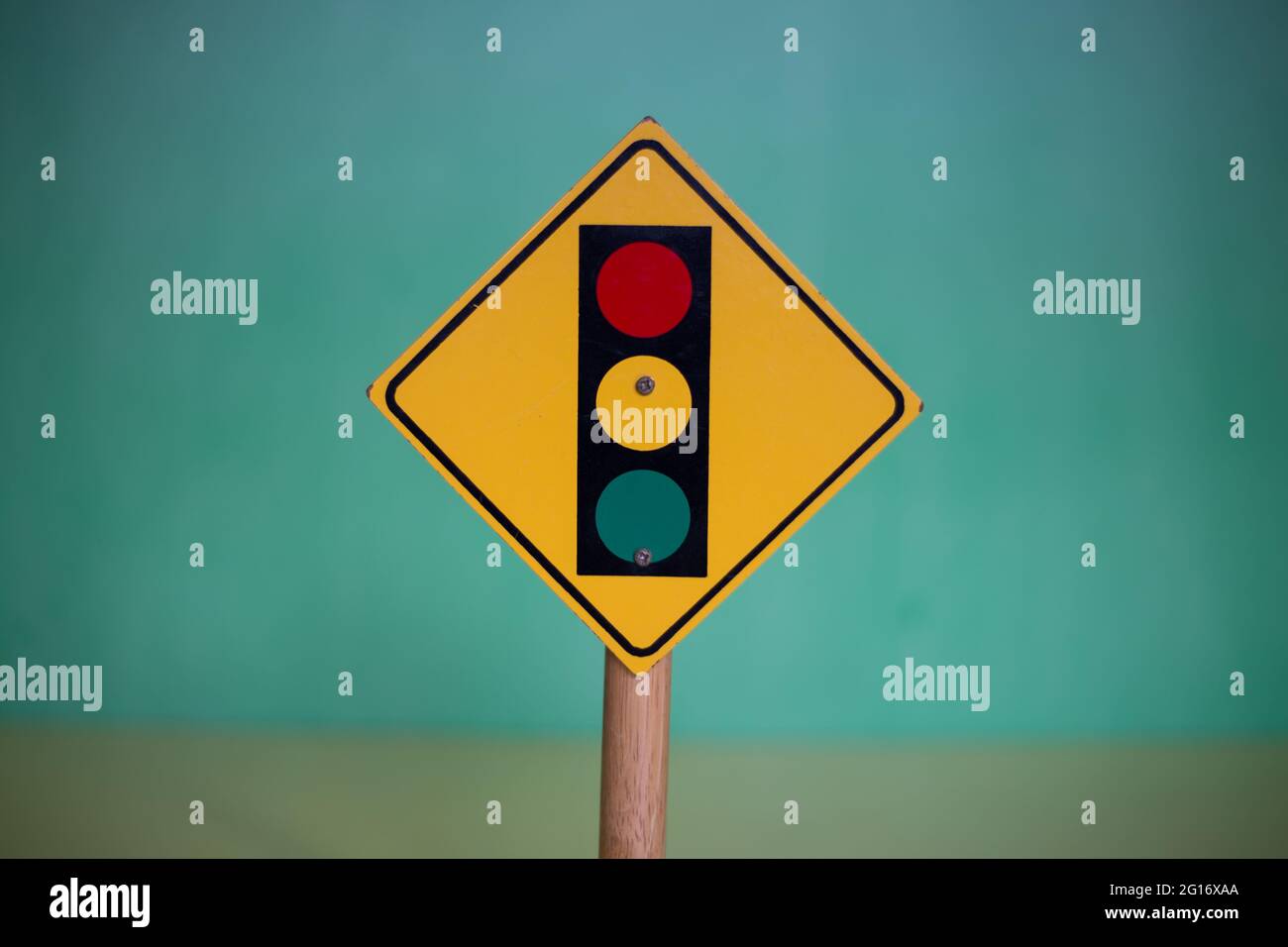 Closeup shot of a yellow traffic lights sign on a blurred background ...