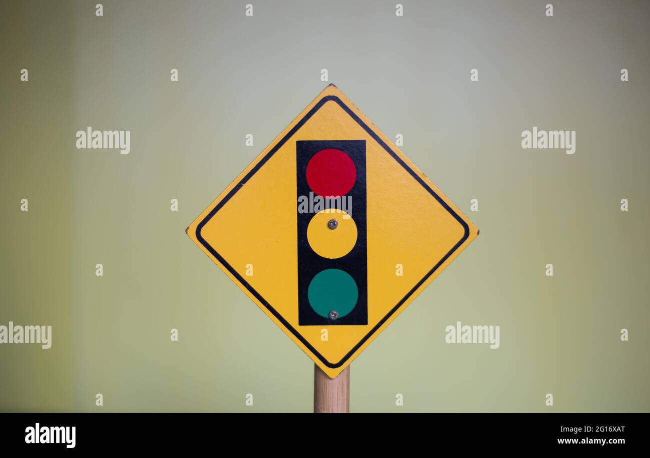 Closeup shot of a yellow traffic lights sign on a blurred background ...