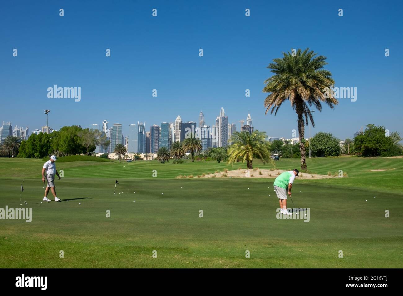 Montgomery Golf Driving Range with a view of the Dubai Marina skyline ...